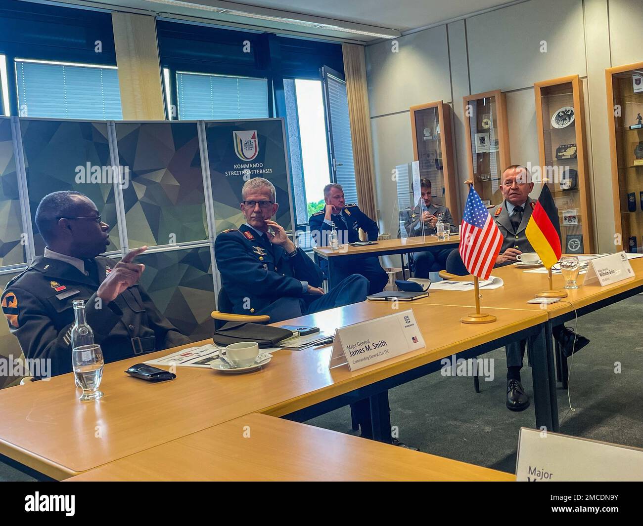 Maj. Gen. James Smith, commanding general, 21st Theater Sustainment Command, left, engages ...