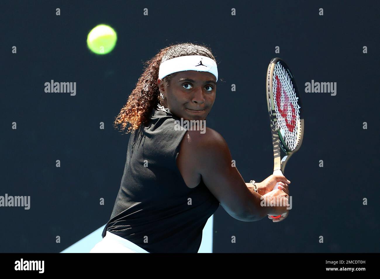 Hailey Baptiste of the United States plays a backhand return to ...