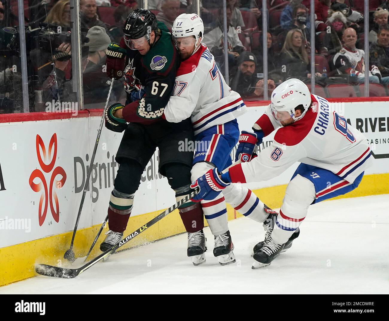 Arizona Coyotes' Lawson Crouse (67) gets double-teamed by Montreal ...