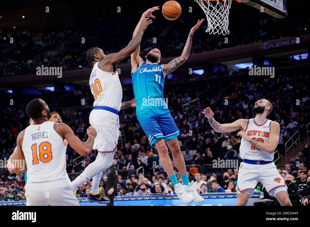 Charlotte Hornets forward Cody Martin (11) is fouled on a shot against ...