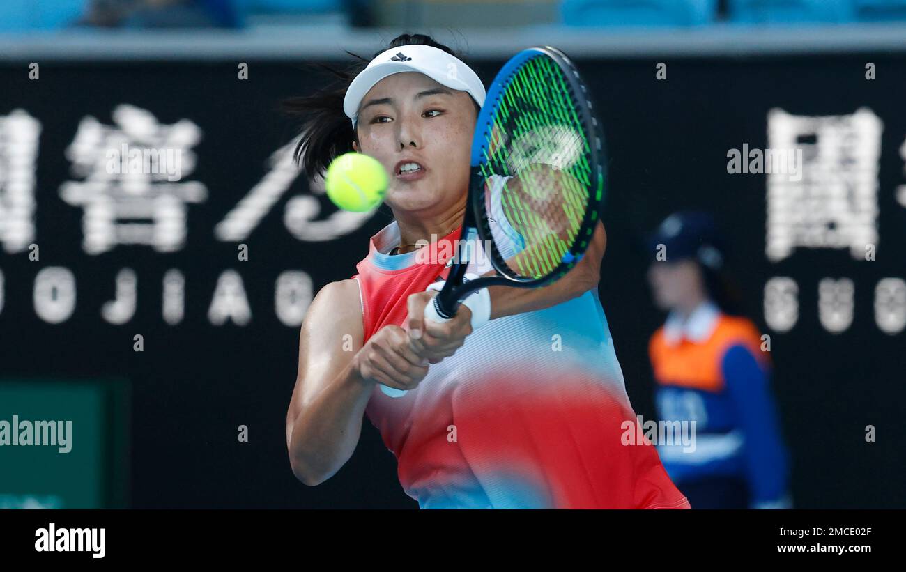 Wang Qiang of China plays a backhand return to Coco Gauff of the U.S ...