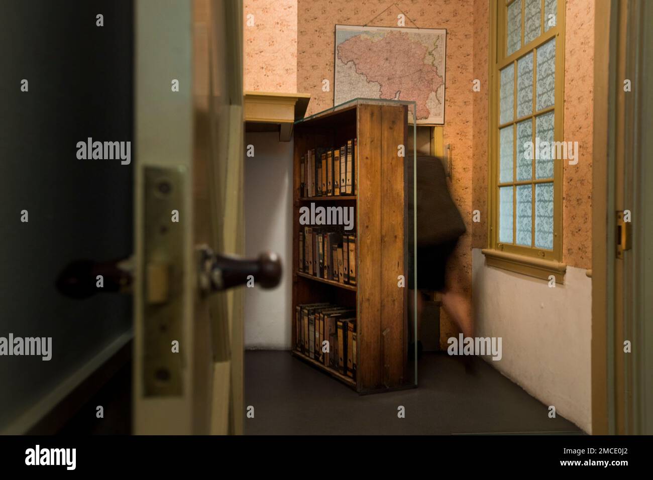 FILE- A woman enters the secret annex at the renovated Anne Frank House ...