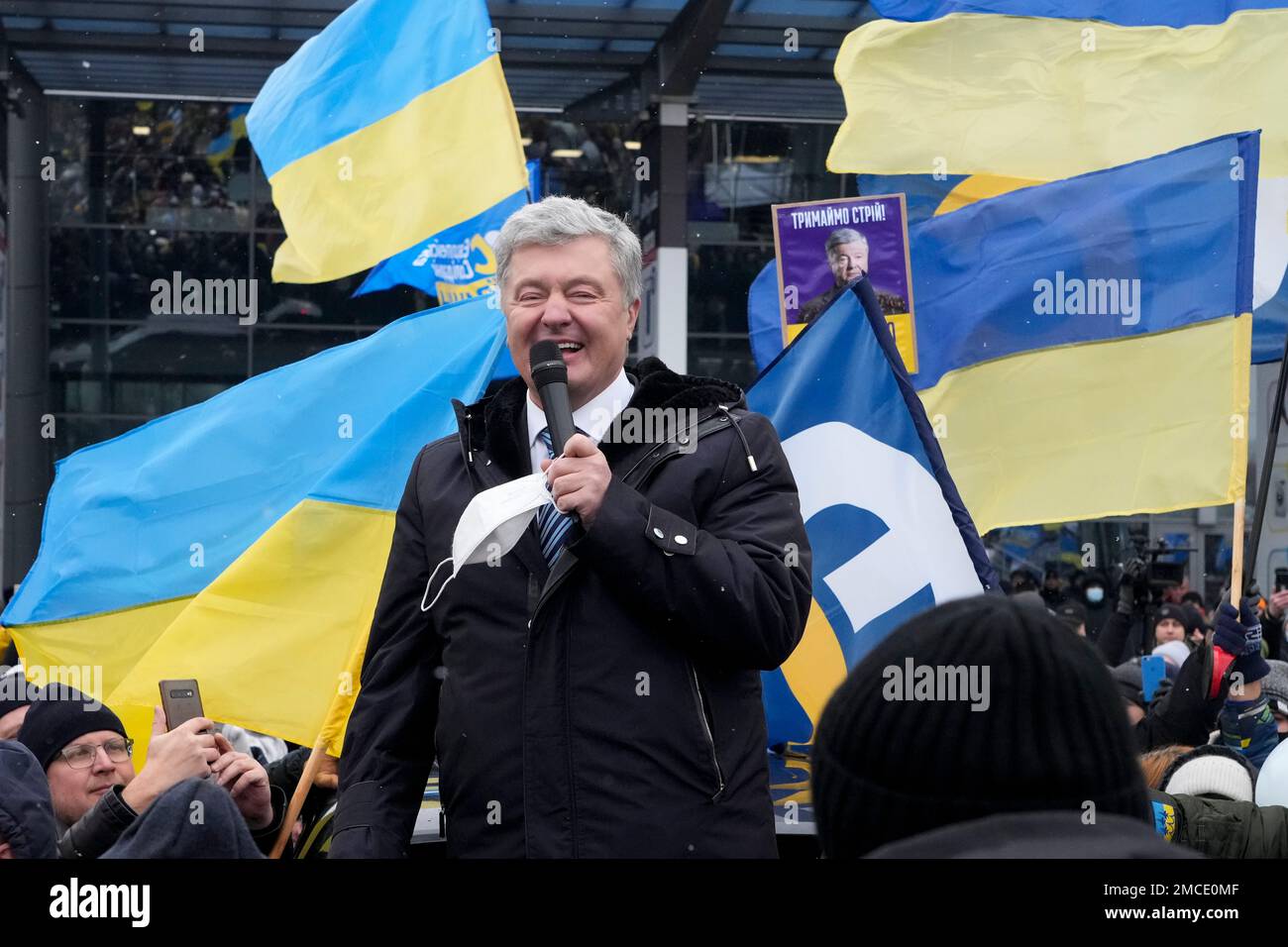 Former Ukrainian President Petro Poroshenko smiles while speaking to ...