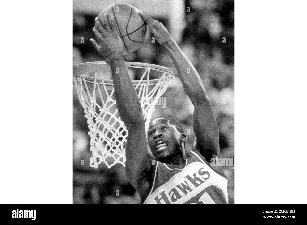 FILE - Atlanta Hawks forward Dominique Wilkins dunks the ball over his ...