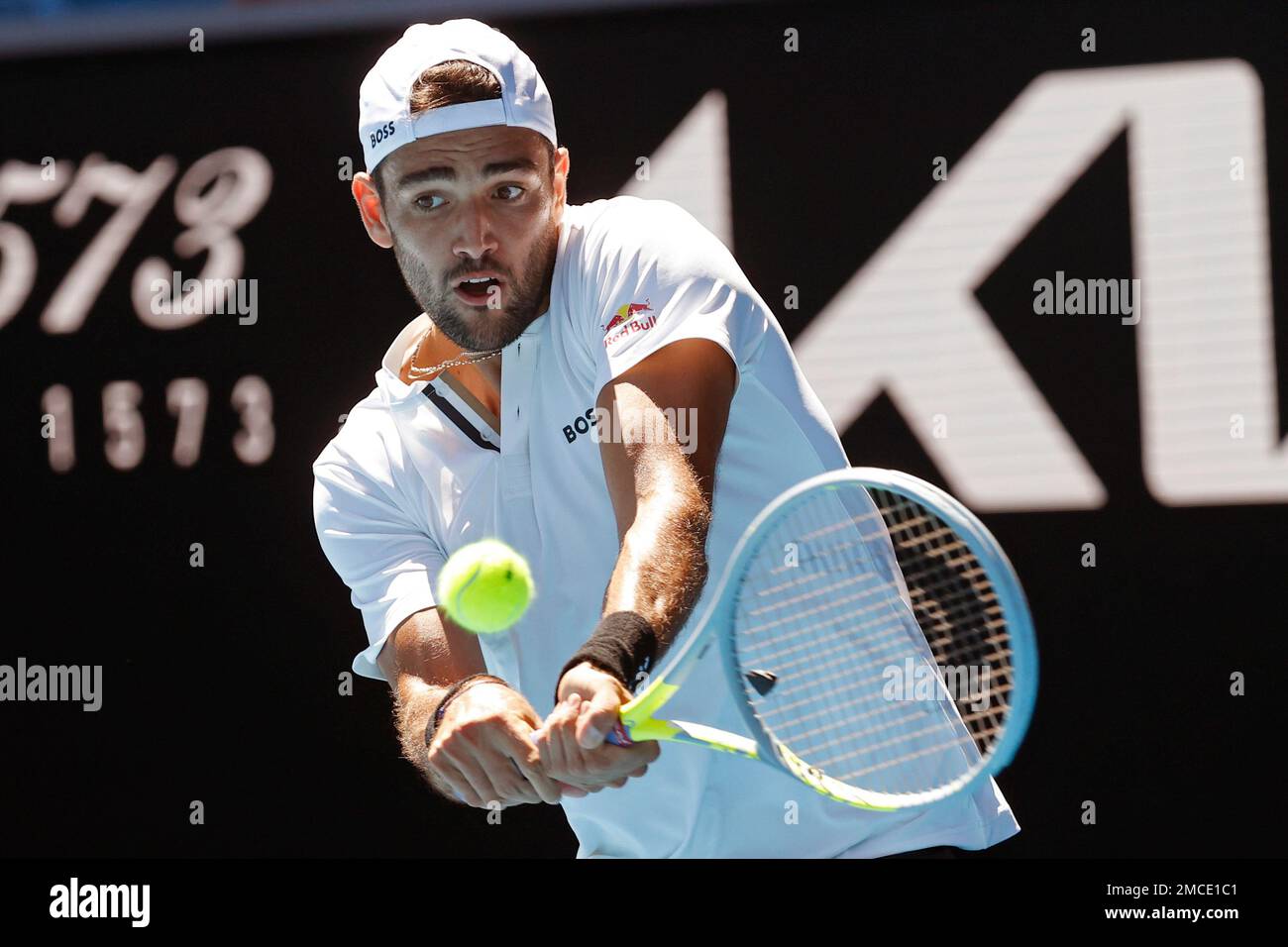 Matteo Berrettini of Italy plays a backhand return to Brandon Nakashima of the U.S. during their ...