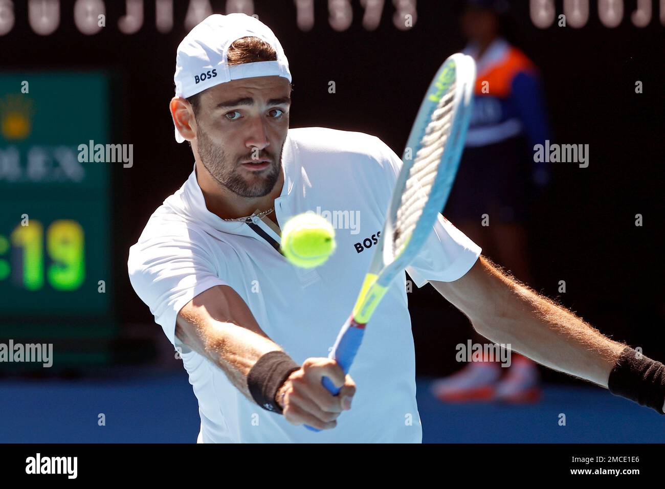Matteo Berrettini of Italy plays a backhand return to Brandon Nakashima of the U.S. during their ...