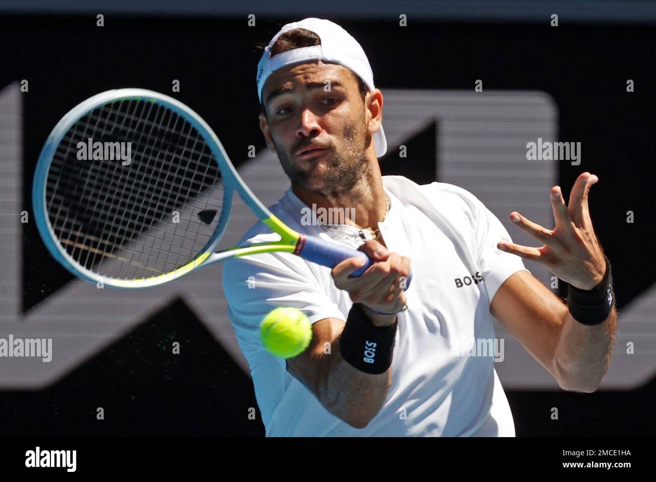 Matteo Berrettini of Italy plays a forehand return to Brandon Nakashima of the U.S. during their ...