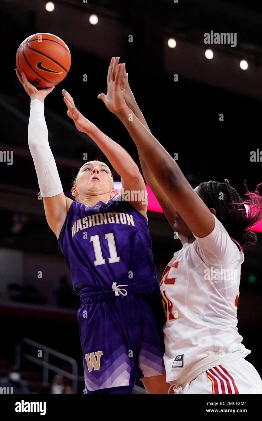 Washington forward Haley Van Dyke, left, shoots as Southern California ...