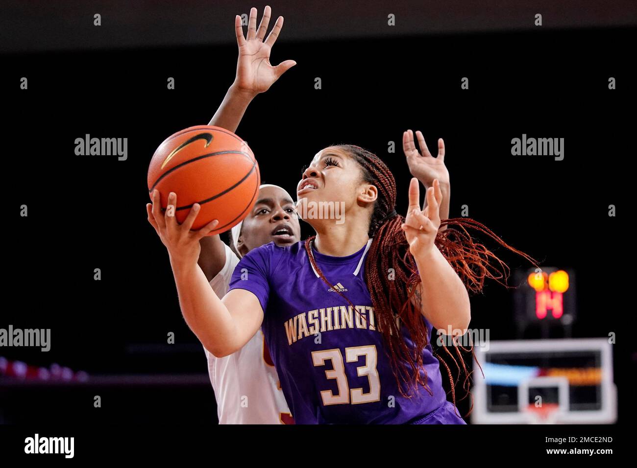 Washington guard Trinity Oliver, right, shoots as Southern California ...