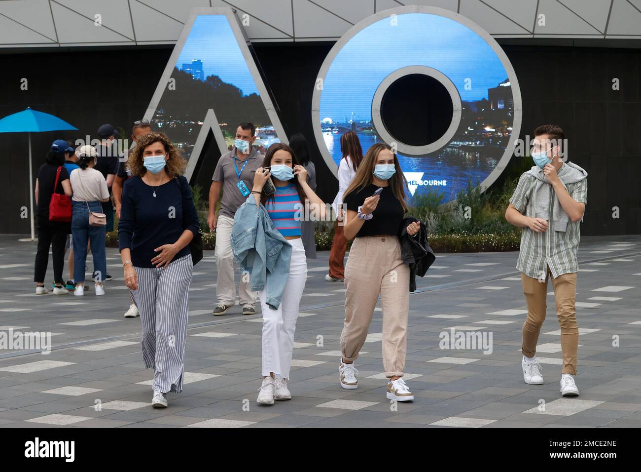 Masked spectators arrive for the first round matches at the Australian ...
