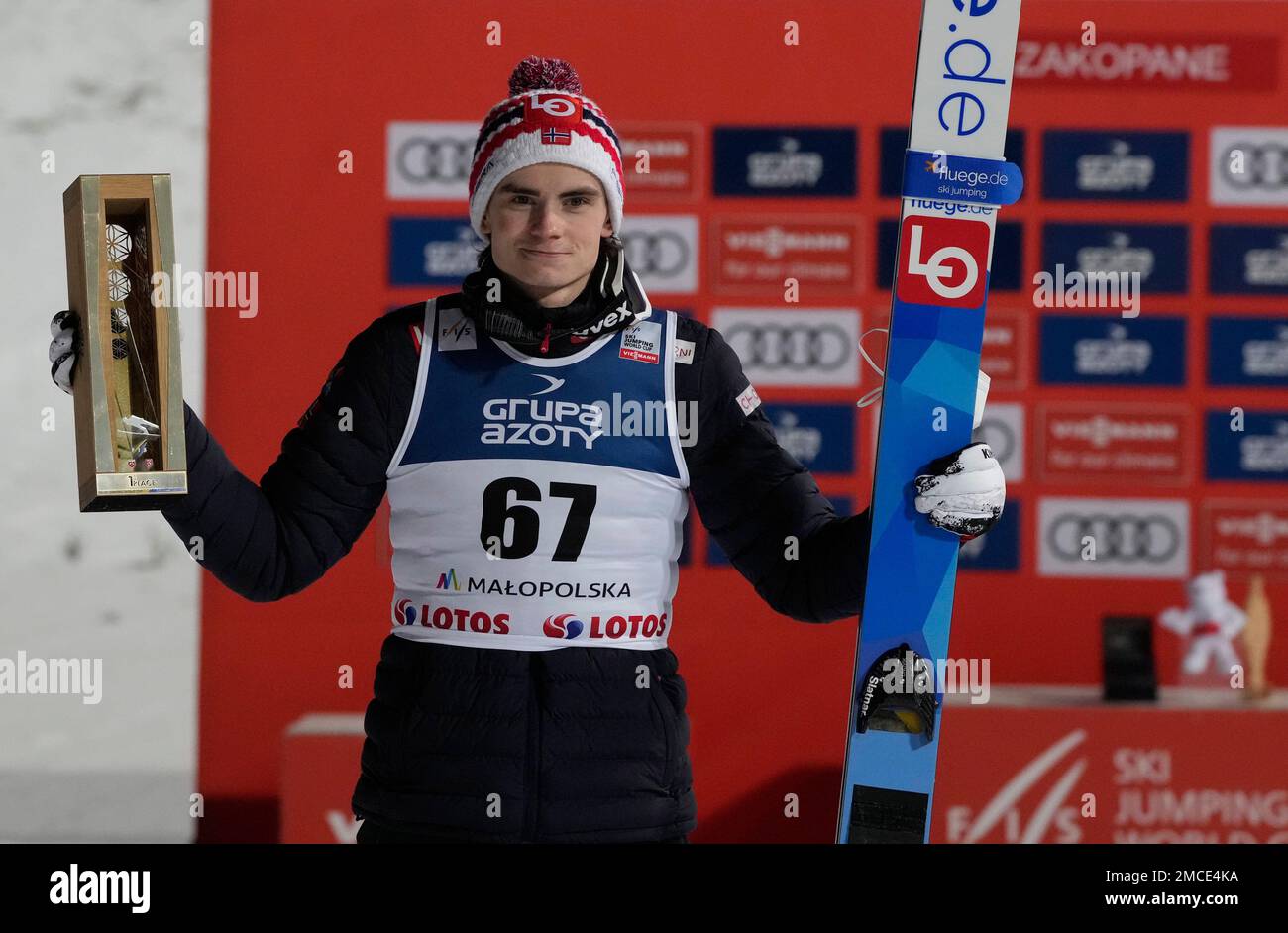 Winner Marius Lindvik of Norway celebrates on the podium after the FIS ...
