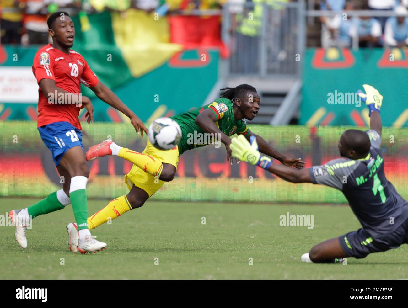 Mali's Adama 'Noss' Traore, centre, heads the ball as he attempts a ...