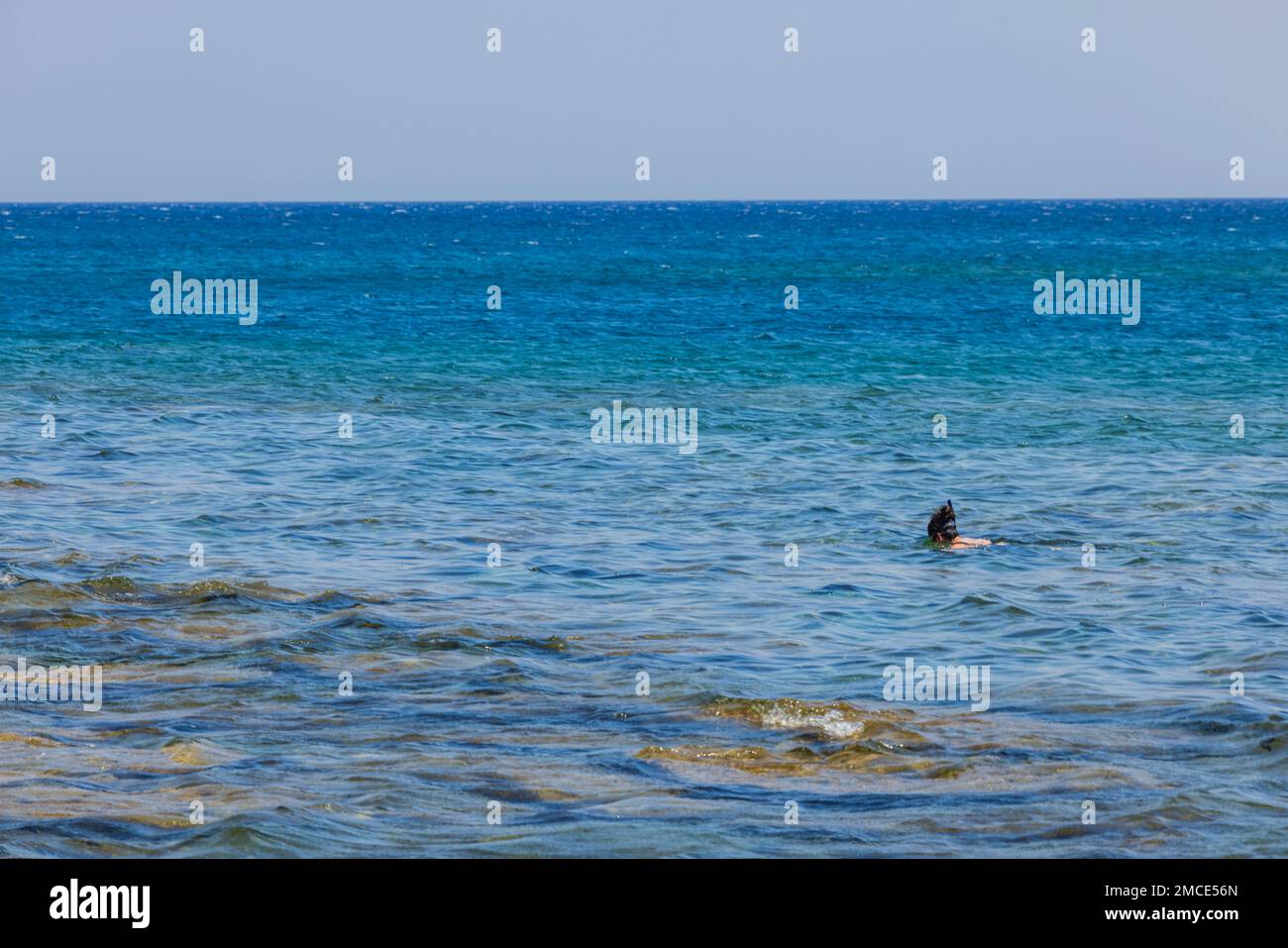 Beautiful view of rocky coast of Mediterranean Sea and man in ...