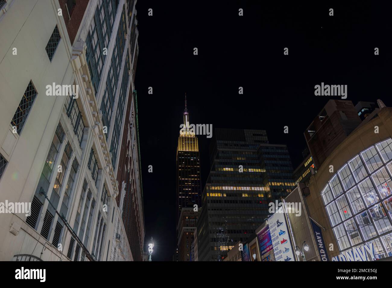 Beautiful backlit view of top of Empire State Building between ...
