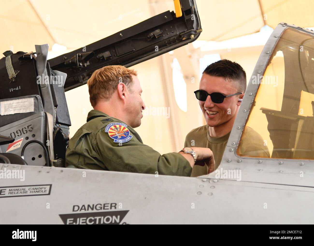 U.S. Air Force Col. Joseph Turnham, 355th Wing commander, is brought in ...