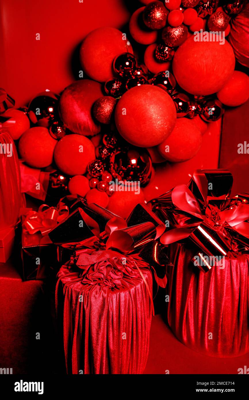Red boxes of gifts and presents in the total red corner Stock Photo - Alamy