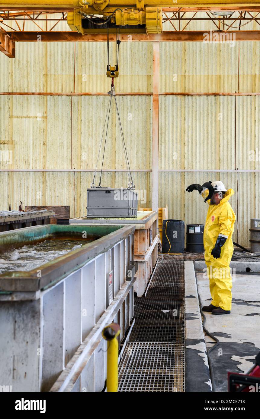 Scottie Stevens, an aerospace outside machinist, uses hand signals to ...