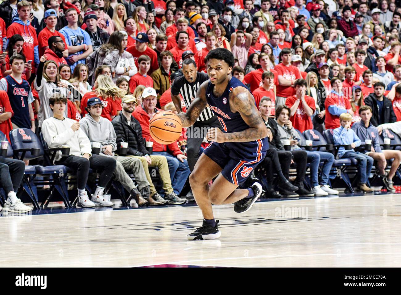 Auburn guard K.D. Johnson (0) drives to the basket against Mississippi ...