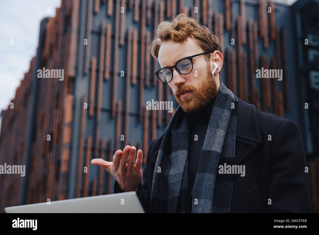 Successful businessman background of the business center. A red-haired ...