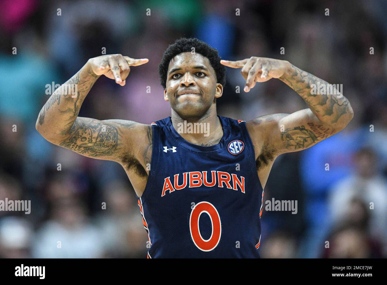Auburn guard K.D. Johnson (0) reacts after his three point basket against Mississippi during the ...