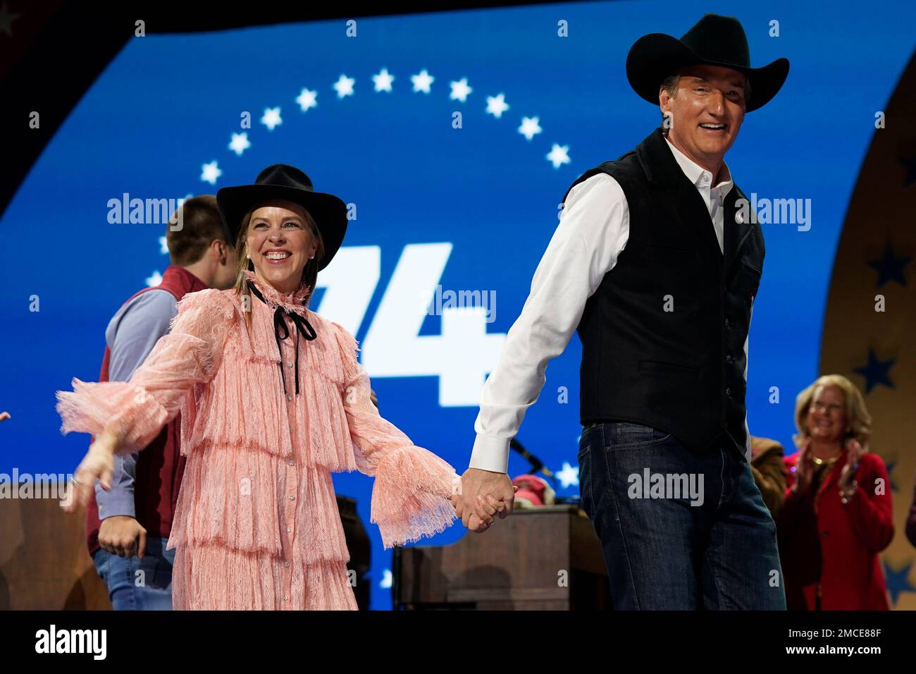 Virginia Gov. Glenn Youngkin, and his wife, Suzanne, arrive on stage ...