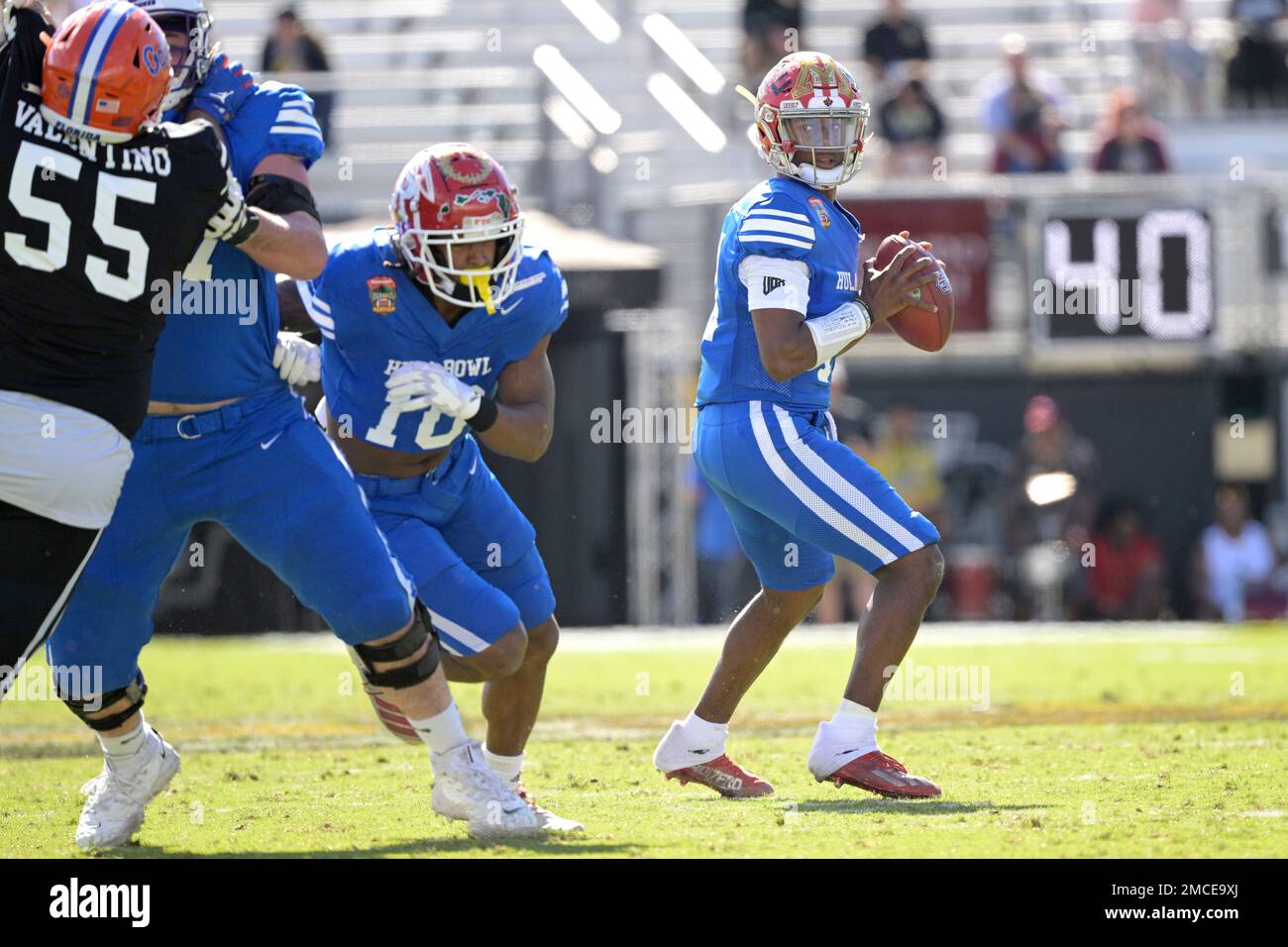Team Kai quarterback Levi Lewis, of Louisiana-Lafayette looks for a ...