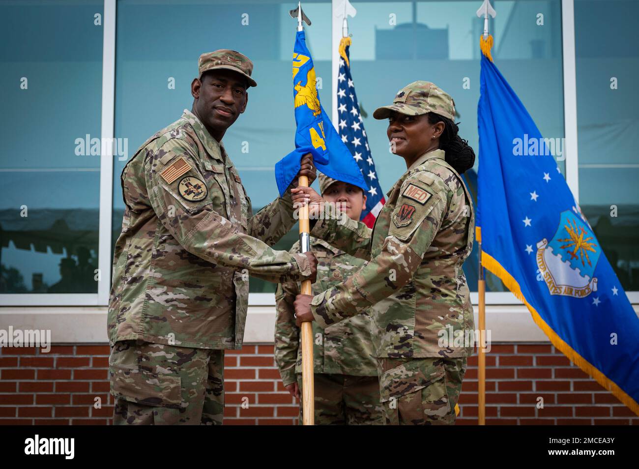 Col. Dolphis Hall, 4th Medical Group commander, passes the guidon to Lt ...