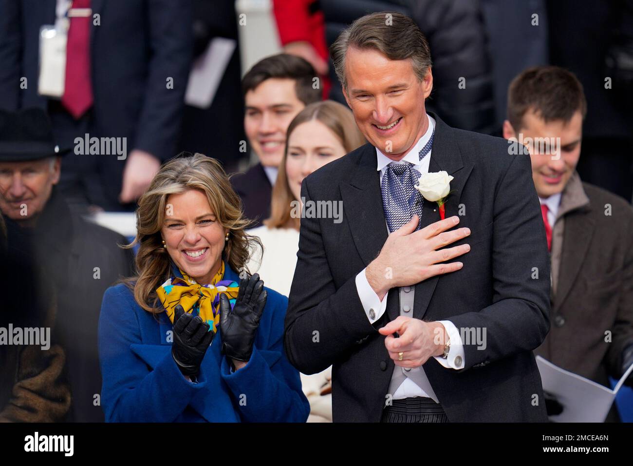 Virginia Gov. Glenn Youngkin, right, and his wife, Suzanne Youngkin, react after he was sworn in ...