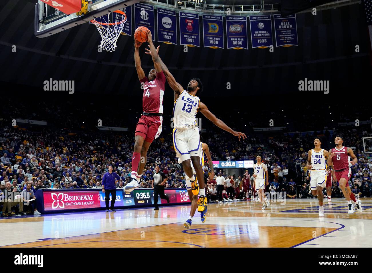 Arkansas guard Davonte Davis (4) goes to the basket against LSU forward ...