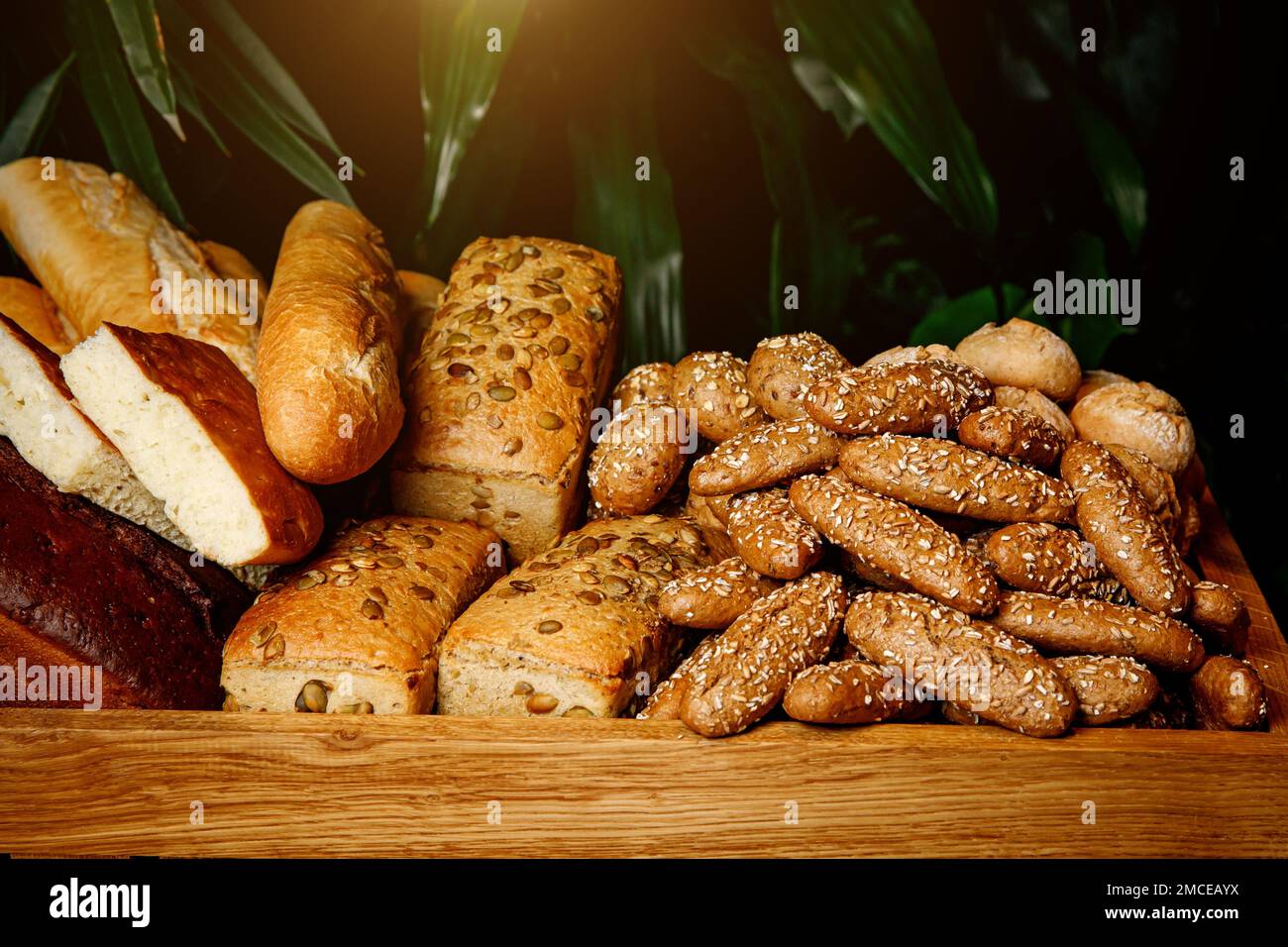 Types of homemade bread in a rustic wooden basket Stock Photo - Alamy