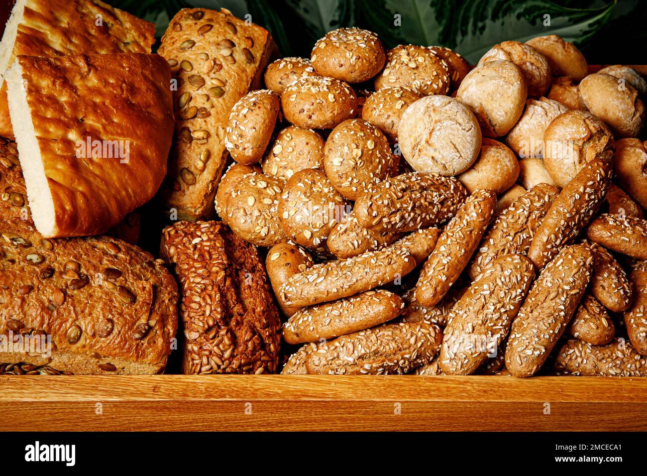 Types of homemade bread in a rustic wooden basket Stock Photo - Alamy