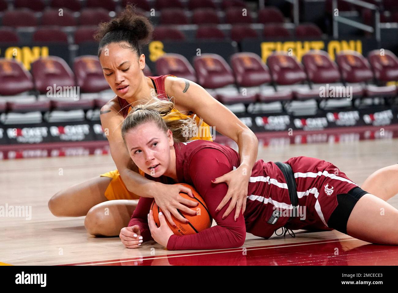 Washington State guard Johanna Teder, below, grabs a loose ball away ...