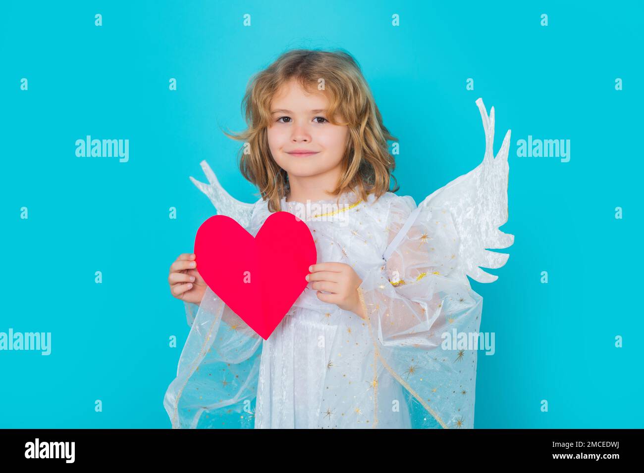 Angel kid with heart. Angel child. Isolated studio shot. Cute kid with ...