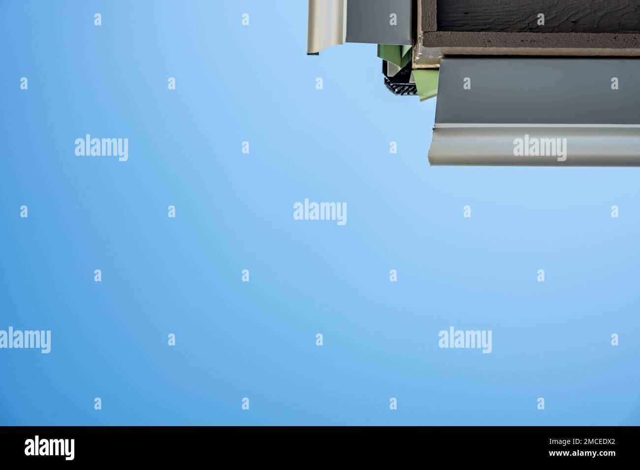 Metal gutters be installed on a residential buildings with two sections ...