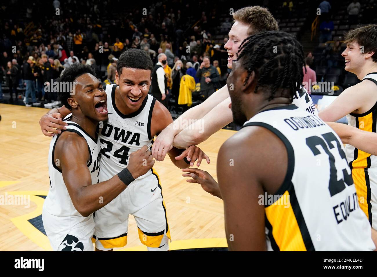 Iowa forward Kris Murray, second from left, celebrates with teammates ...
