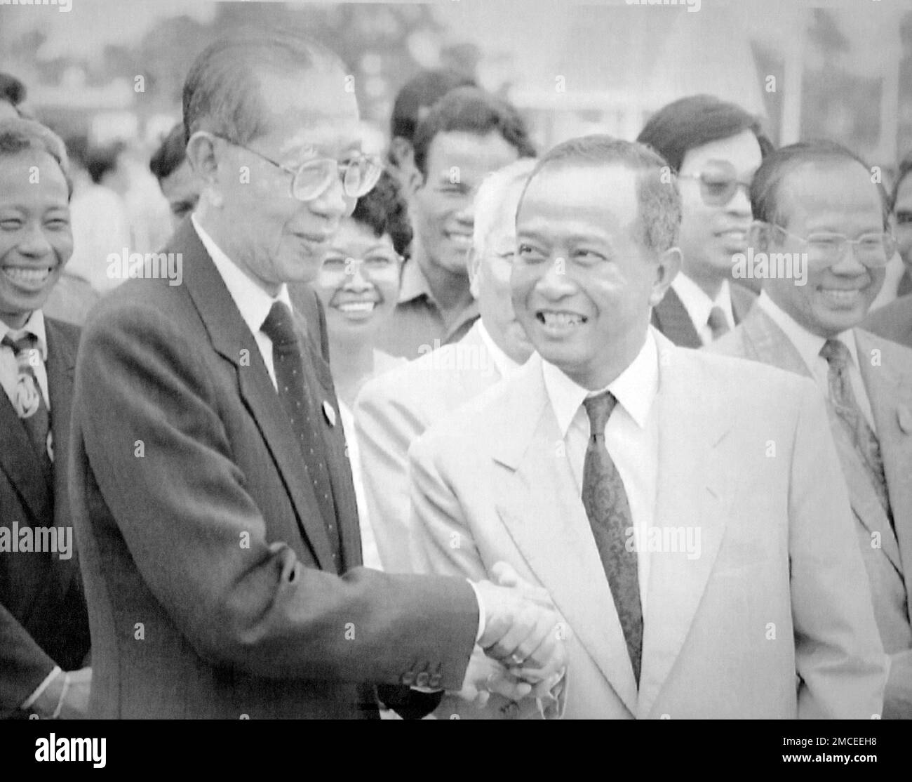 Political rivals Son Sann, left, and Prince Norodom Ranariddh shake ...
