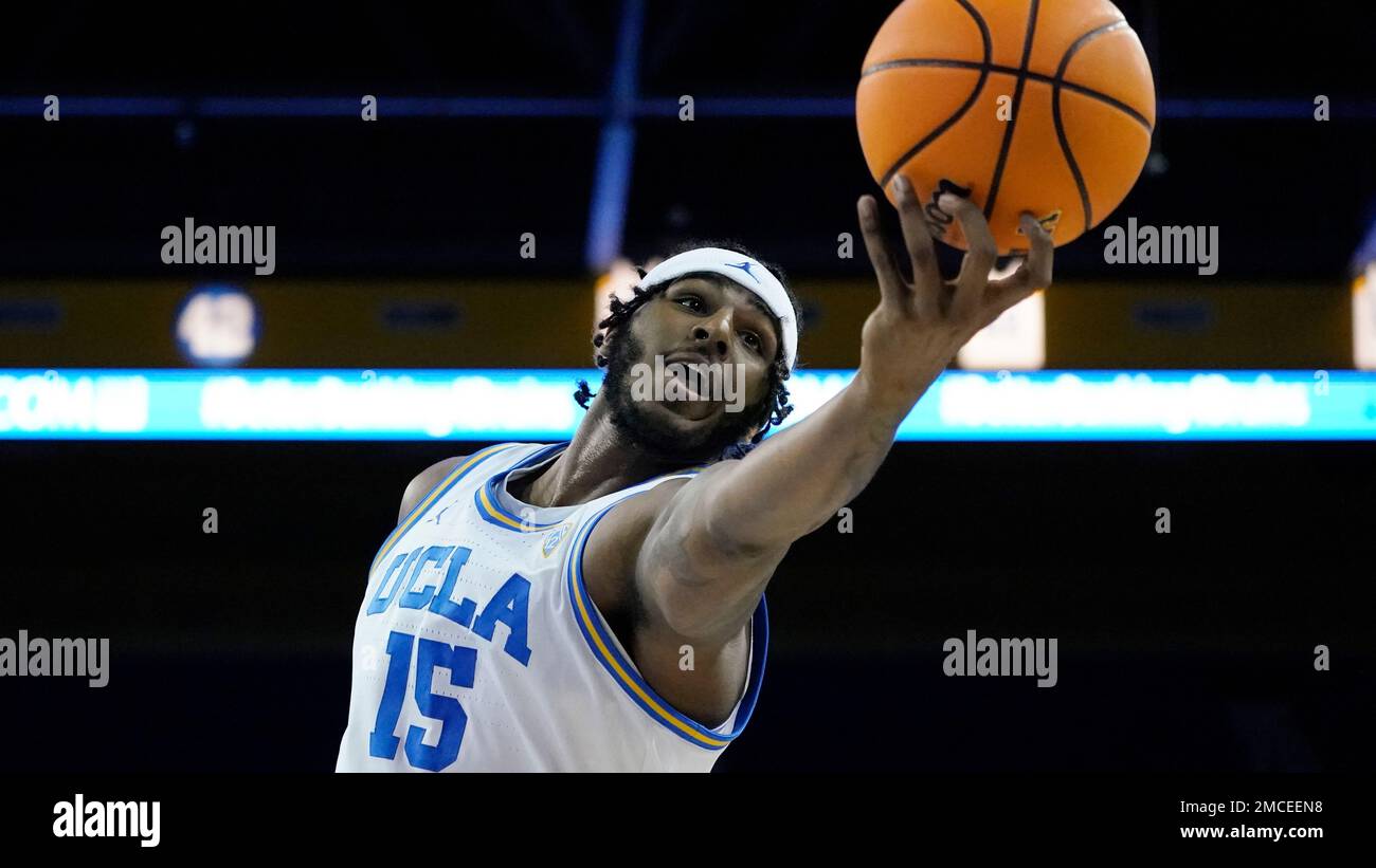 UCLA center Myles Johnson (15) reaches for a rebound during an NCAA ...
