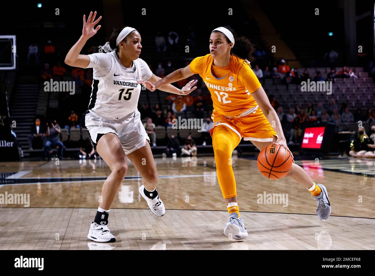 Tennessee guard Rae Burrell (12) drives against Vanderbilt forward ...