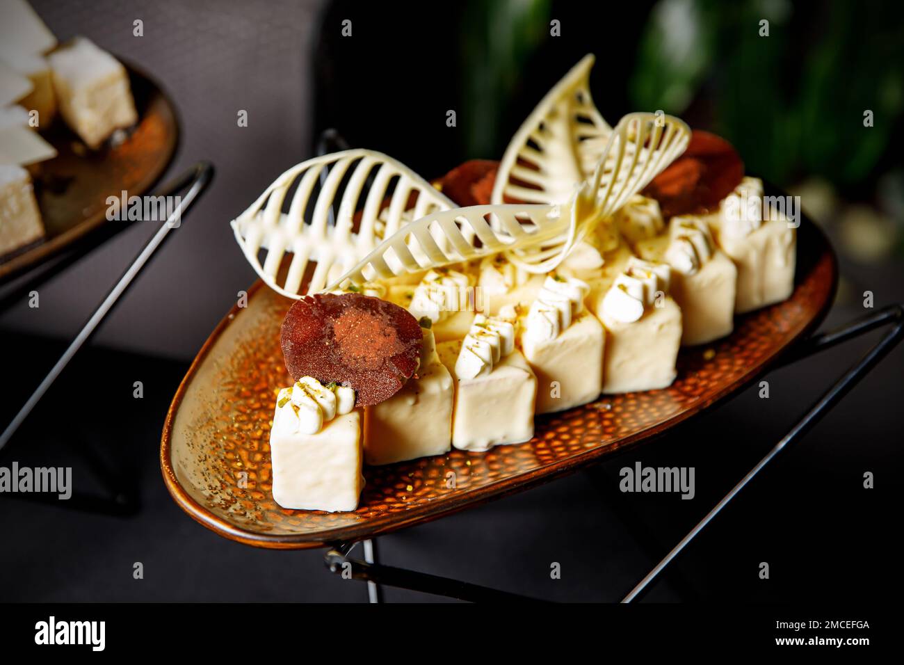 White chocolate candies on a plate. Decorated homemade chocolates Stock ...