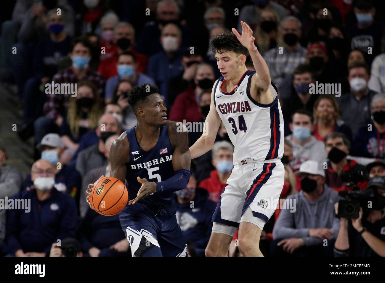 BYU forward Gideon George (5) controls the ball while defended by ...