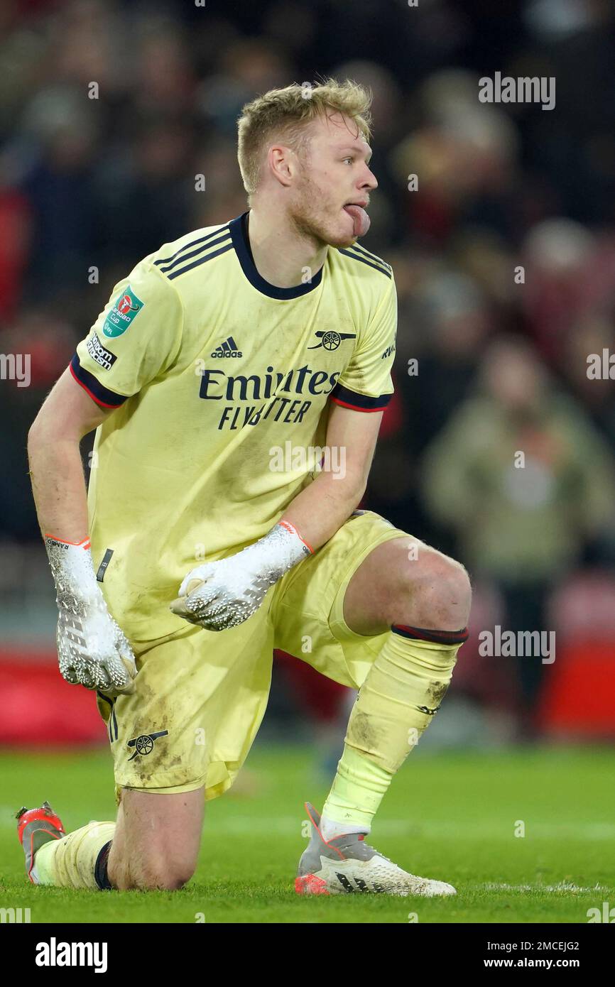Arsenal's goalkeeper Aaron Ramsdale sticks his tongue out at the end of ...