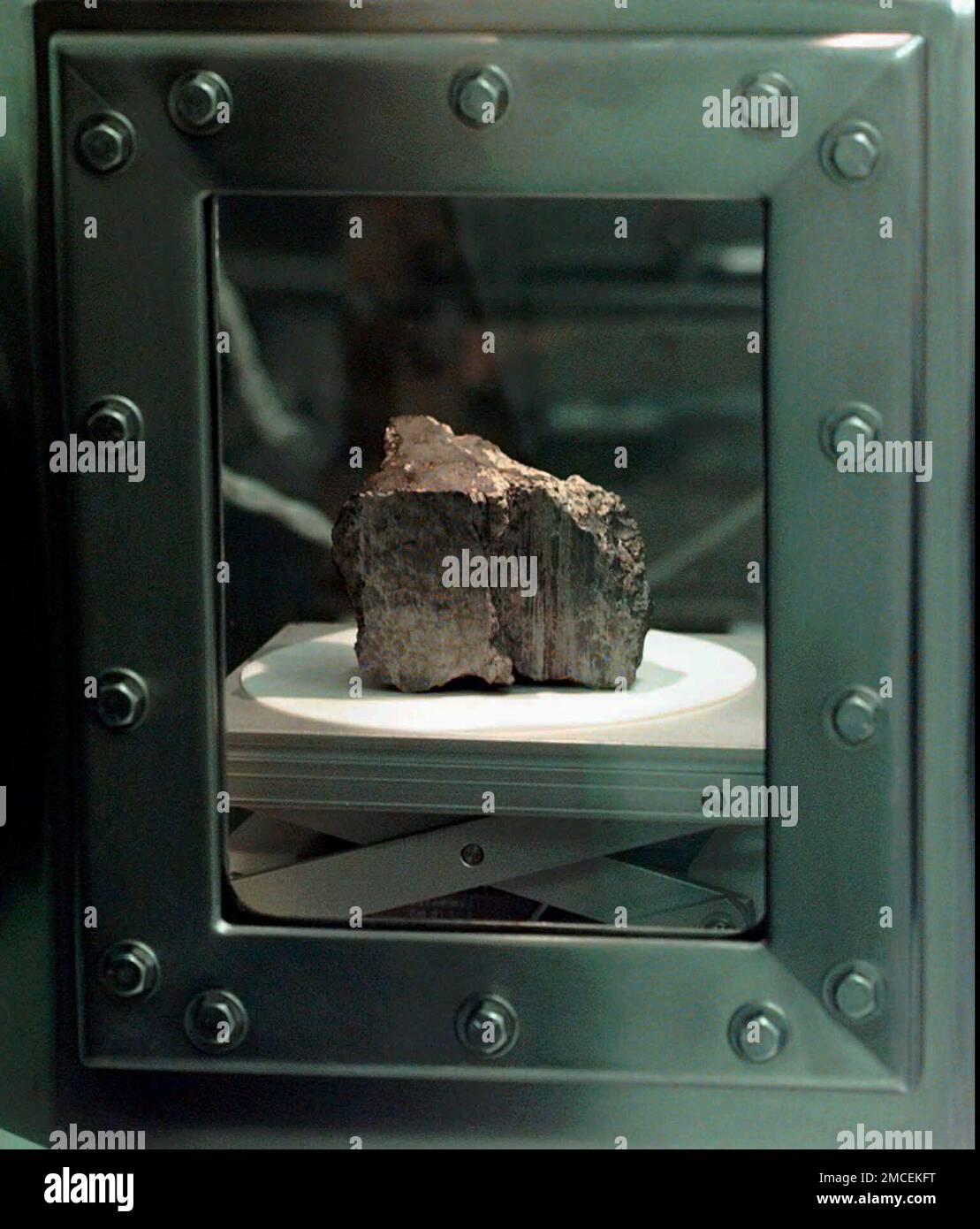 The meteorite labeled ALH84001 sits in a chamber at a Johnson Space ...