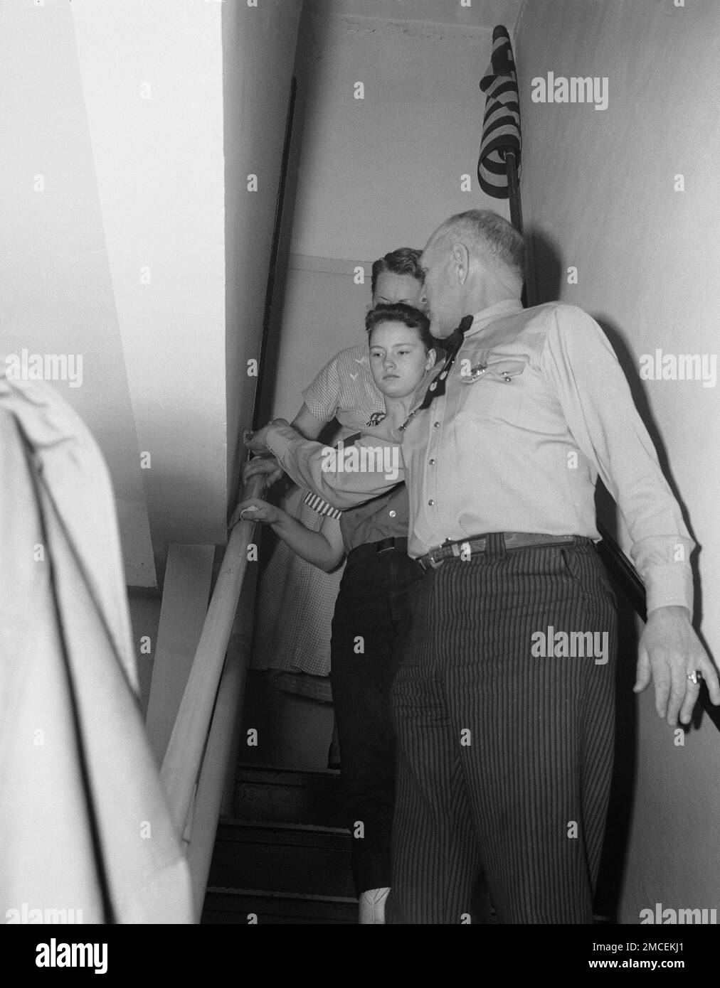 Caril Ann Fugate, center, is led down the stairs of the Converse County ...