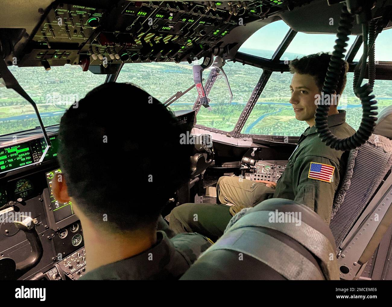 Sam Mathis (right), U.S. Air Force Academy cadet 2nd class, sits in the ...