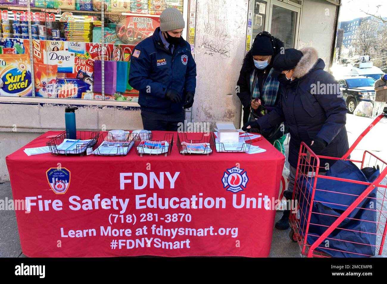 An FDNY Fire Safety Education Unit member distributes fire safety ...