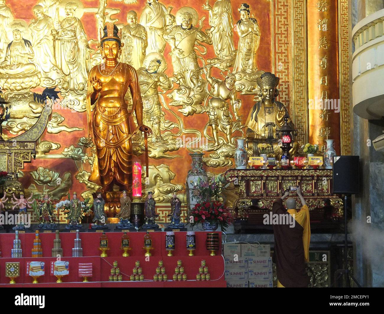 Manila, Philippines. 21st Jan, 2023. A Buddhist monk takes a photo of a ...