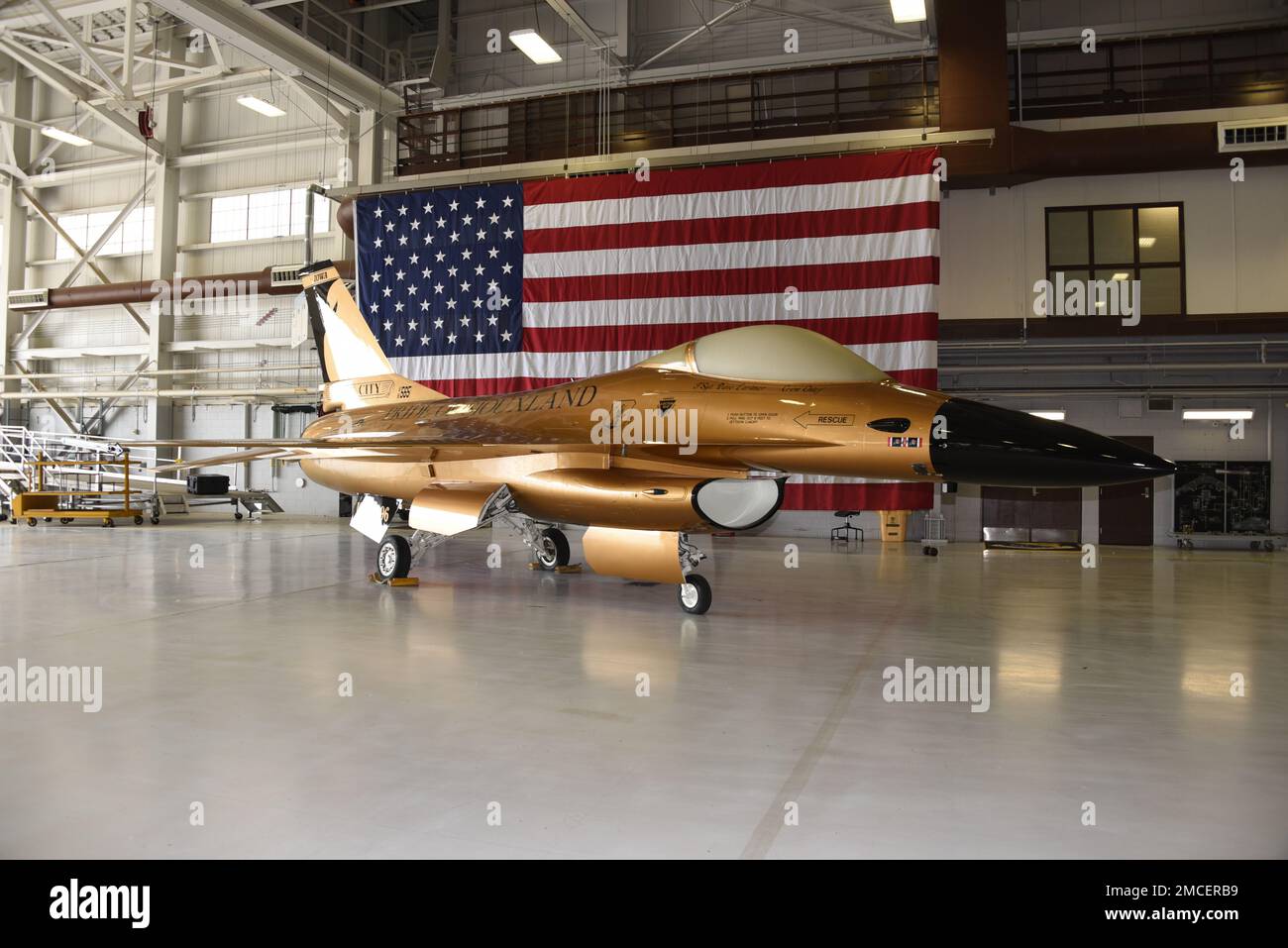 A gold U.S. Air Force F-16A Falcon from the Iowa Air National Guard is ...