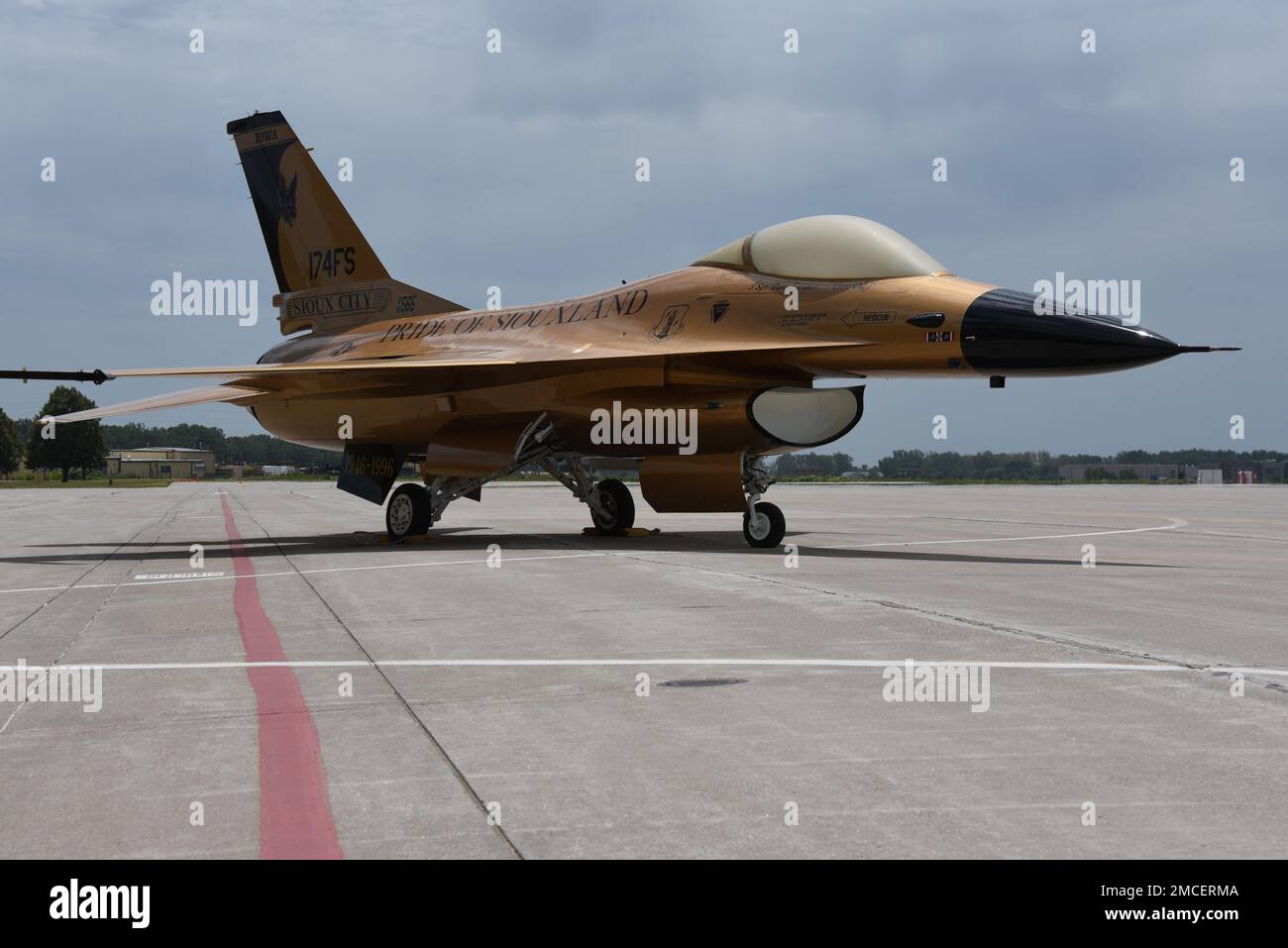 A gold U.S. Air Force F-16A Falcon from the Iowa Air National Guard is ...