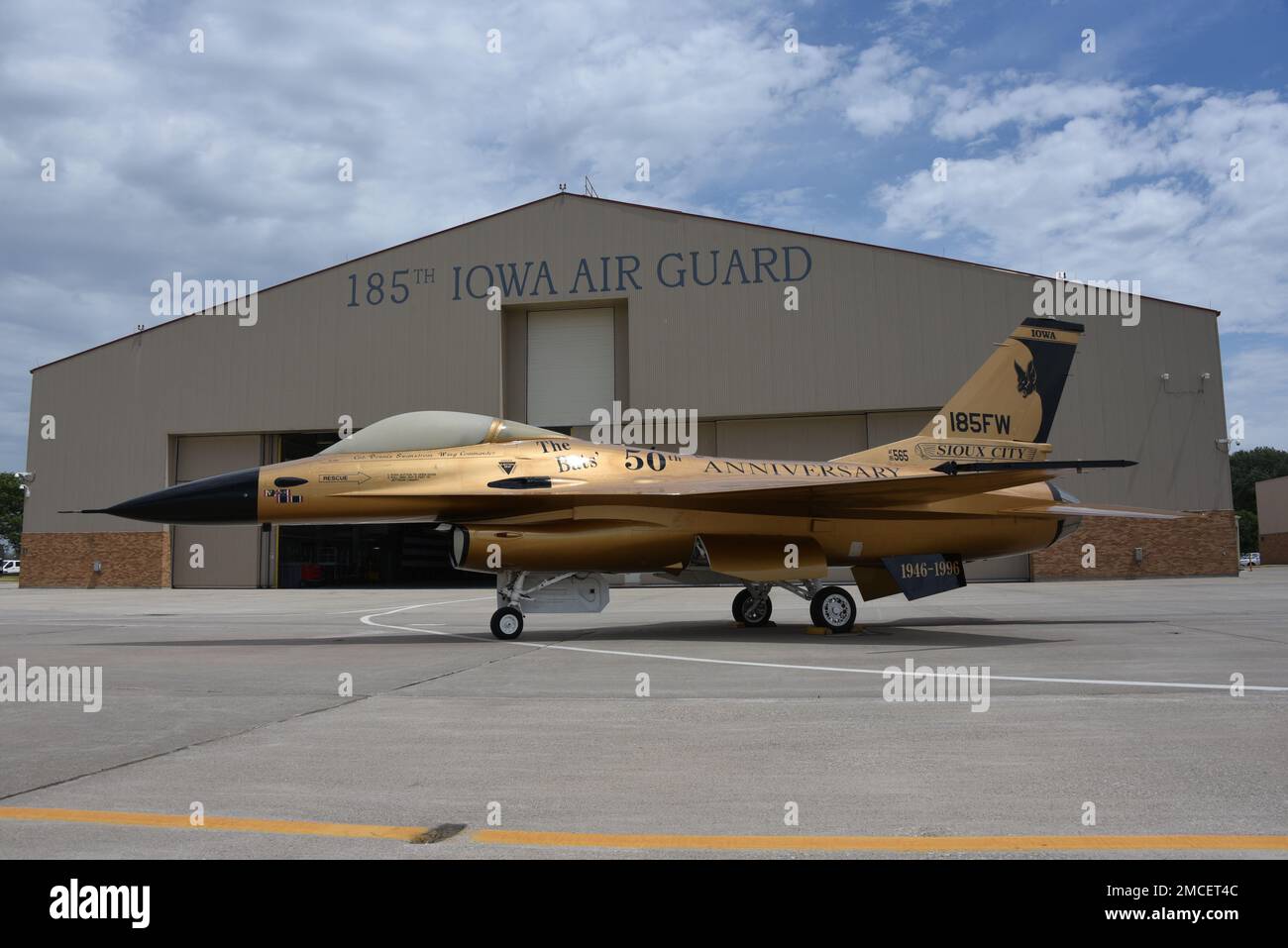 A gold U.S. Air Force F-16A Falcon from the Iowa Air National Guard is ...