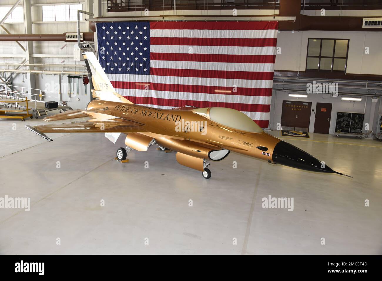 A gold U.S. Air Force F-16A Falcon from the Iowa Air National Guard is ...